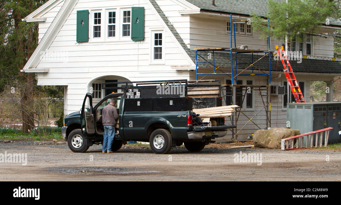 Building carpenter with his truck lorry at his work site Stock Photo ...
