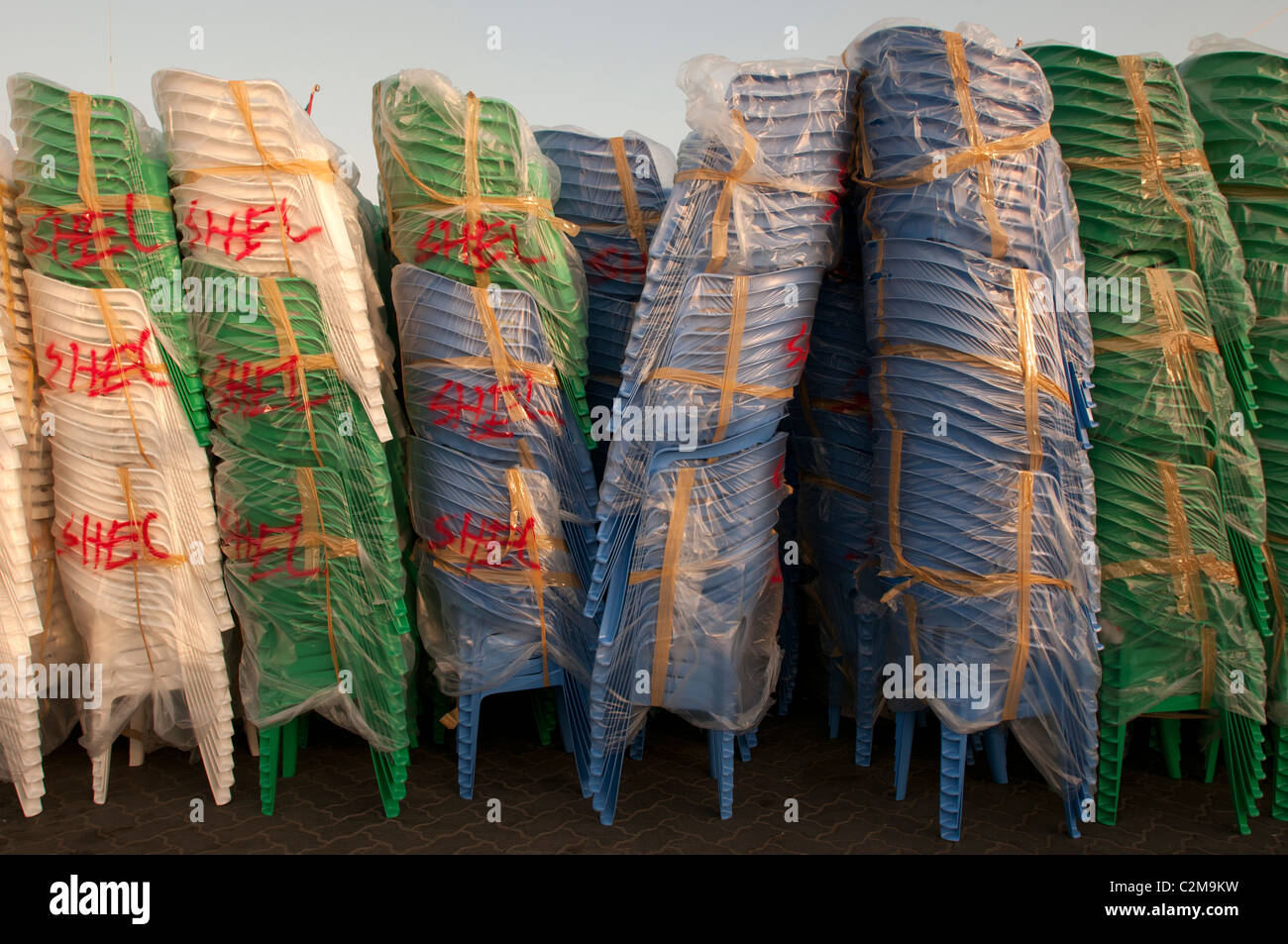 Stacks of plastic chairs Stock Photo - Alamy