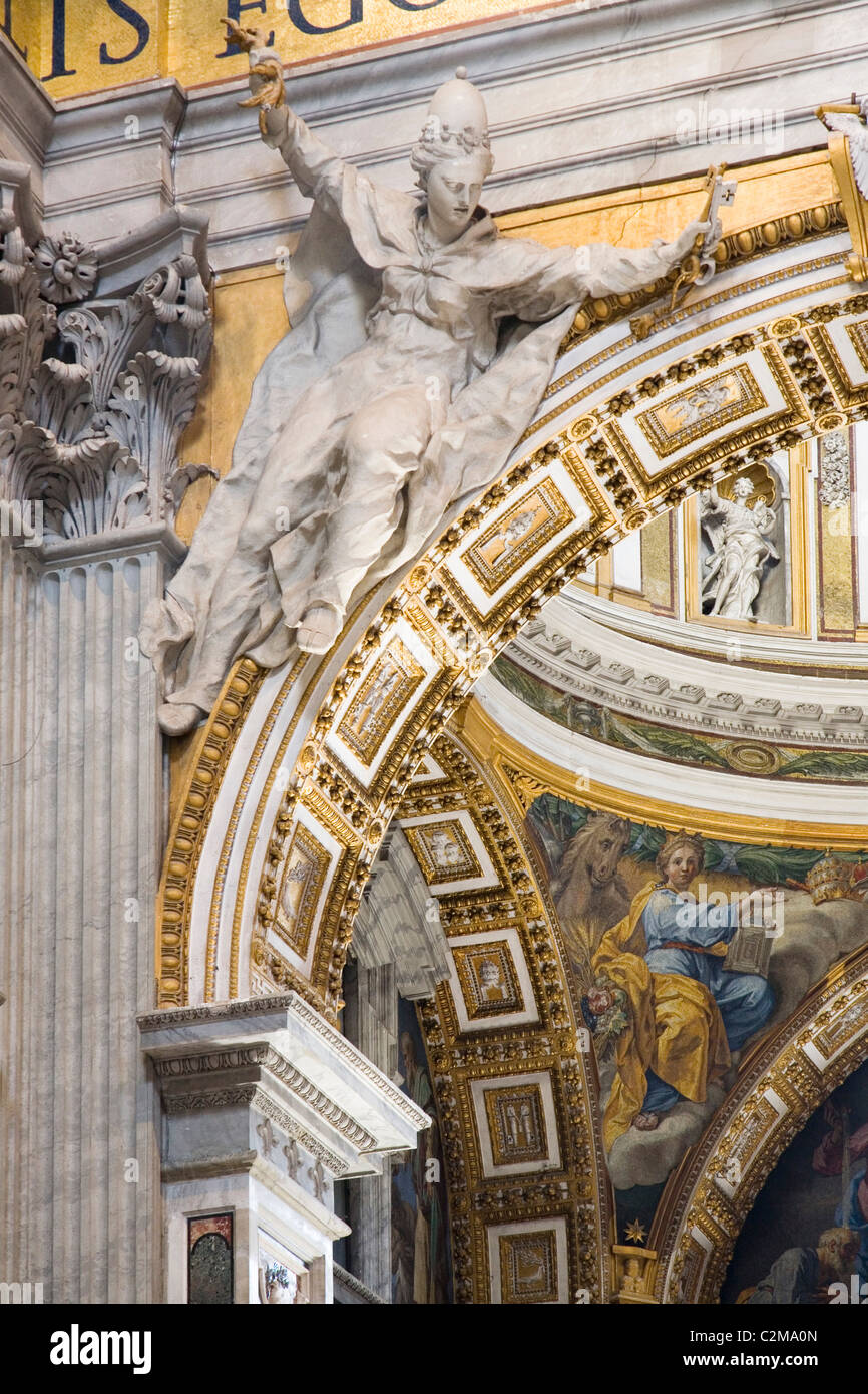 Column detail with statue at St Peter's Basilica, Vatican City, Rome ...