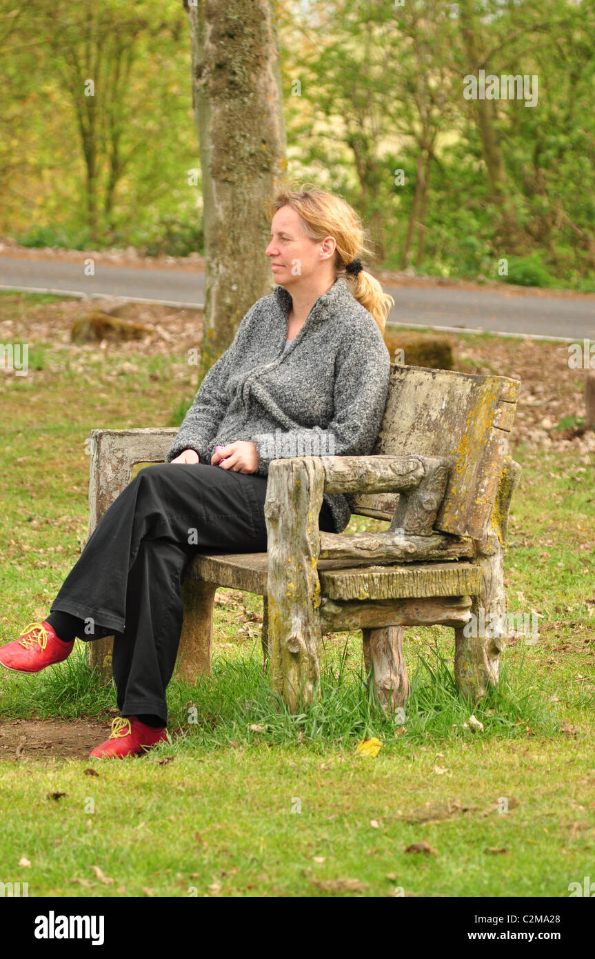Lady on Bench Stock Photo - Alamy