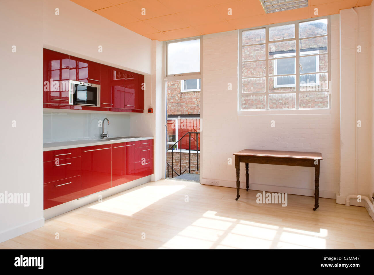 Renovated small empty office units with wooden floors Stock Photo - Alamy