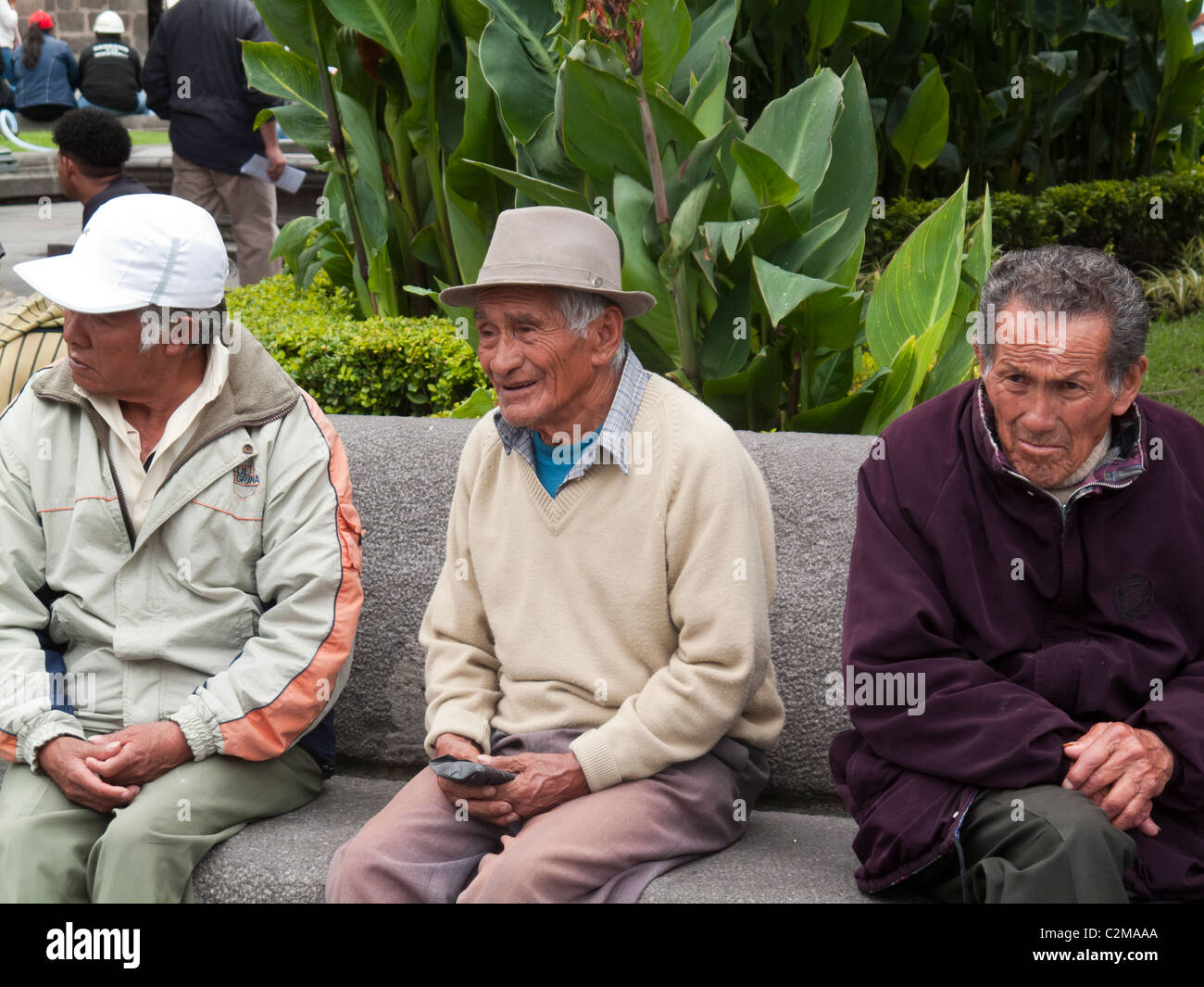 three men sitting on a bench, Plaza Grande, Centro Historico, Quito ...