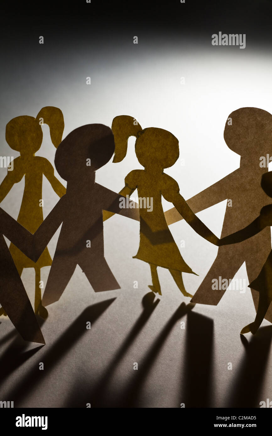 Paper Chain girls and boys, concept of Teamwork Stock Photo - Alamy