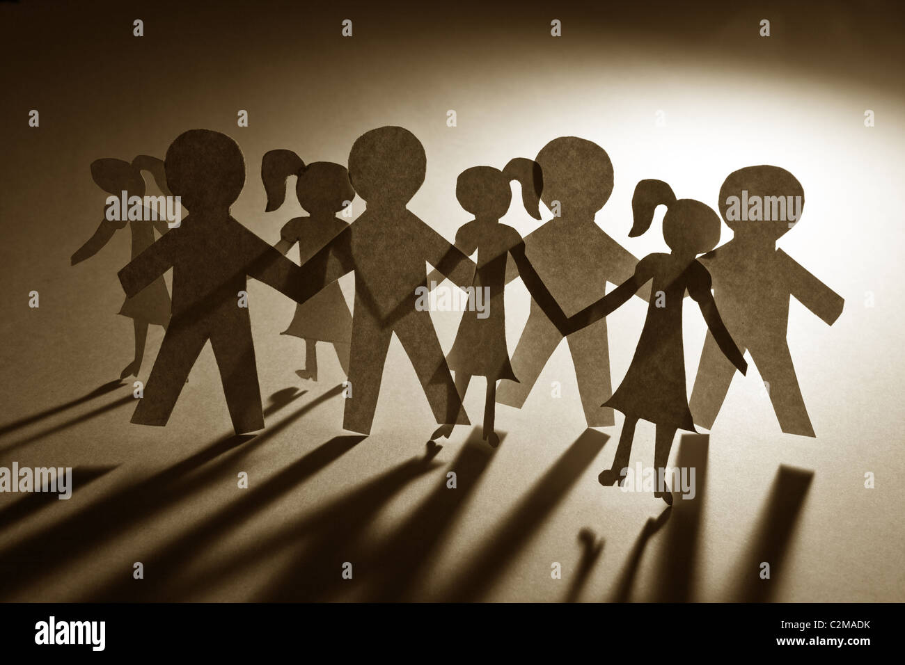 Paper Chain girls and boys, concept of Teamwork Stock Photo - Alamy