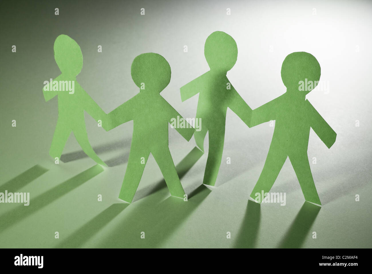 Paper Chain Men, concept of Teamwork Stock Photo - Alamy