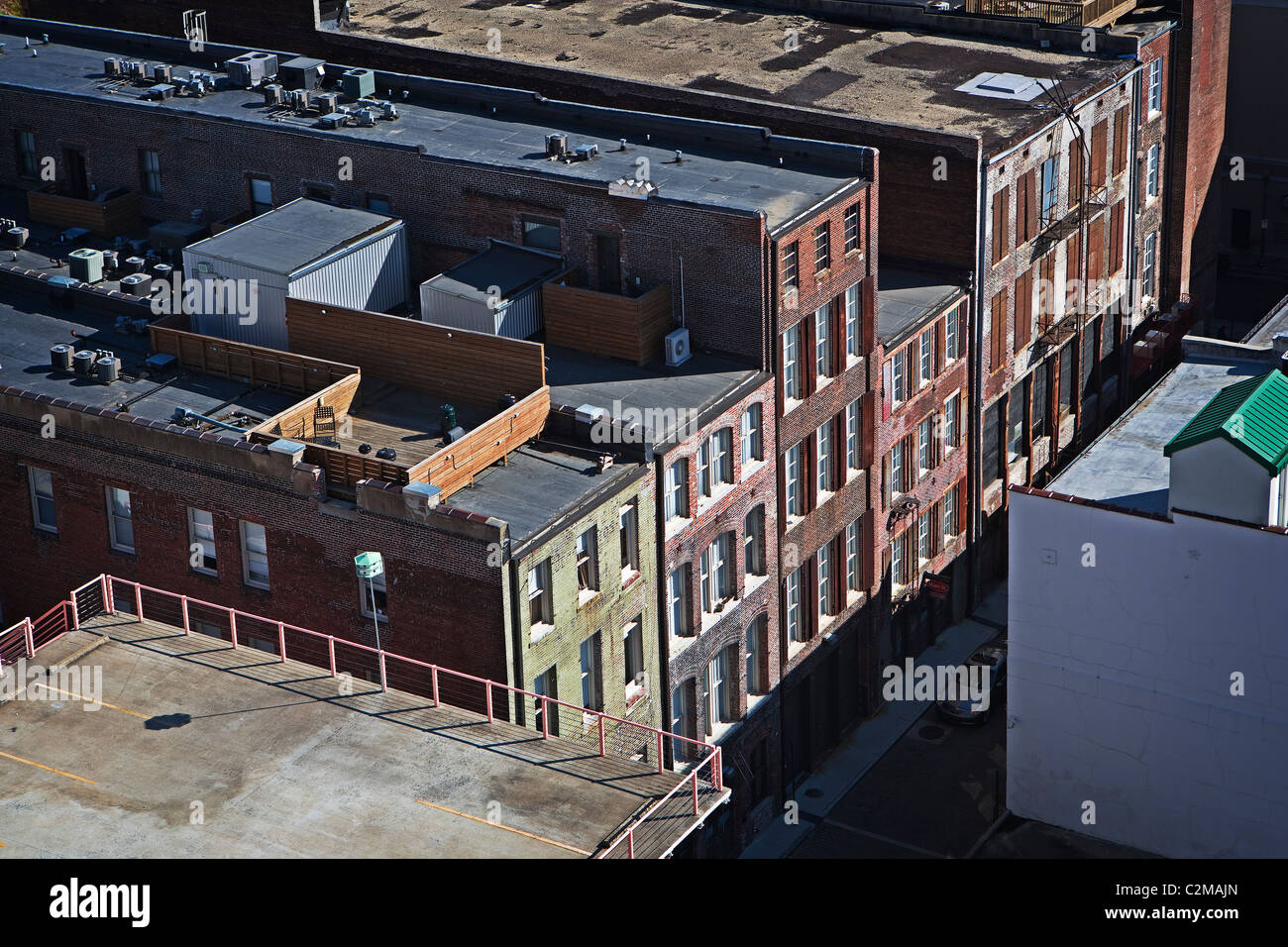 Urban rooftops in the hot summer heat with rooftops and brick buildings ...