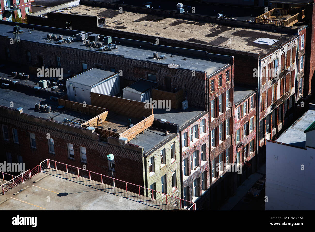Urban rooftops in the hot summer heat with rooftops and brick buildings ...