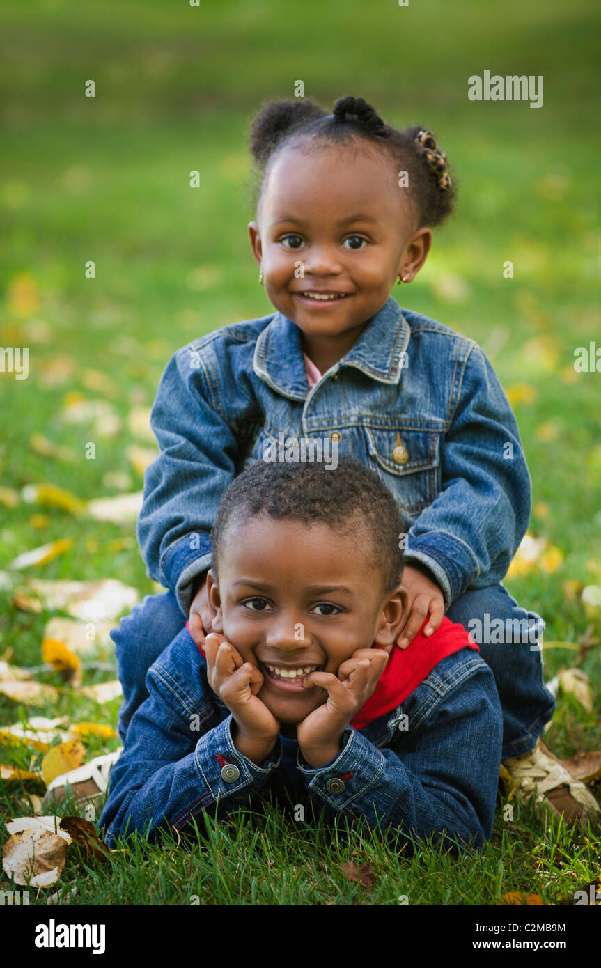 Brother And Sister Posing In The Fall Leaves Stock Photo - Alamy