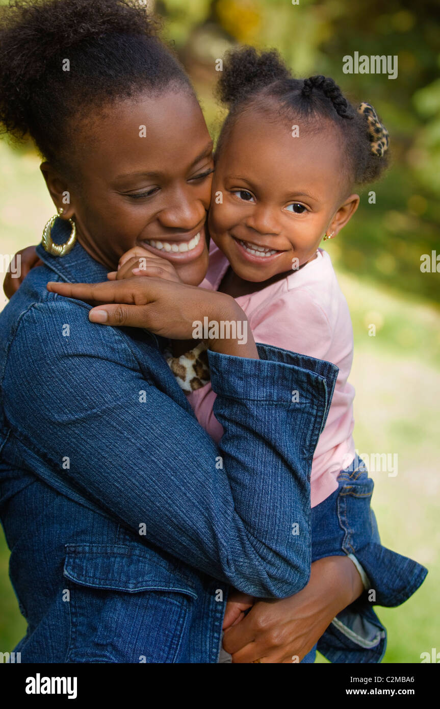 Mother And Daughter Hugging Stock Photo - Alamy