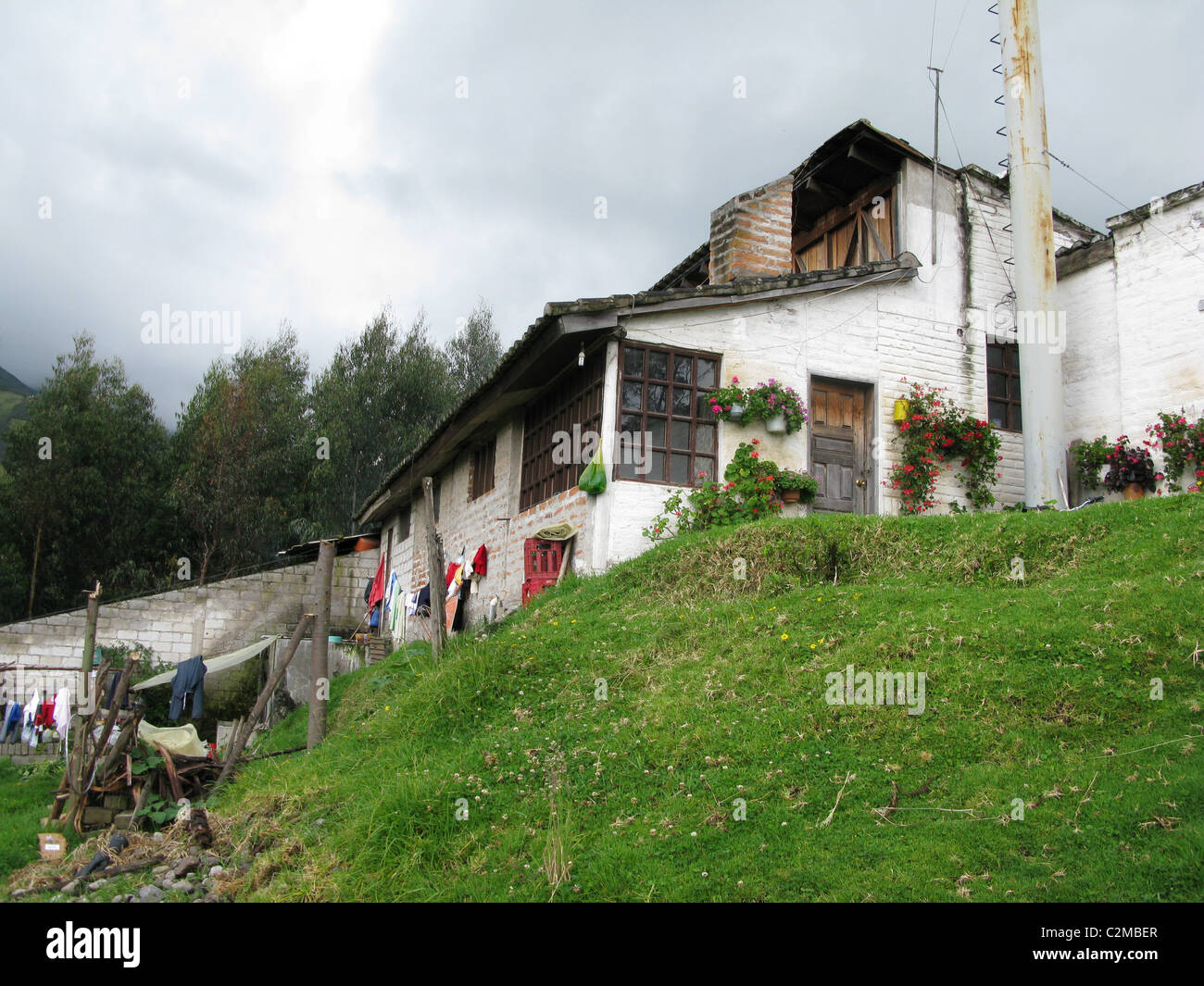 A charming house on a hill in Equator country side Stock Photo - Alamy