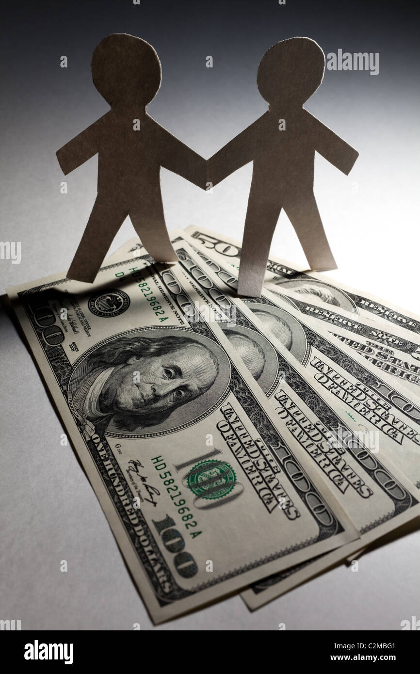 Dollar and Paper Chain Men close up Stock Photo - Alamy