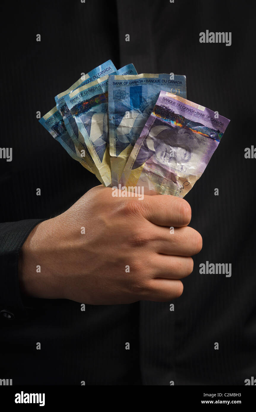 Fist Full Of Cash Stock Photo - Alamy