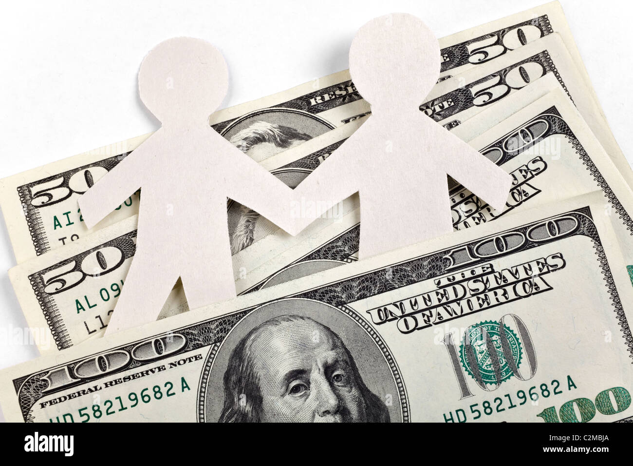 Dollar and Paper Chain Men close up Stock Photo - Alamy