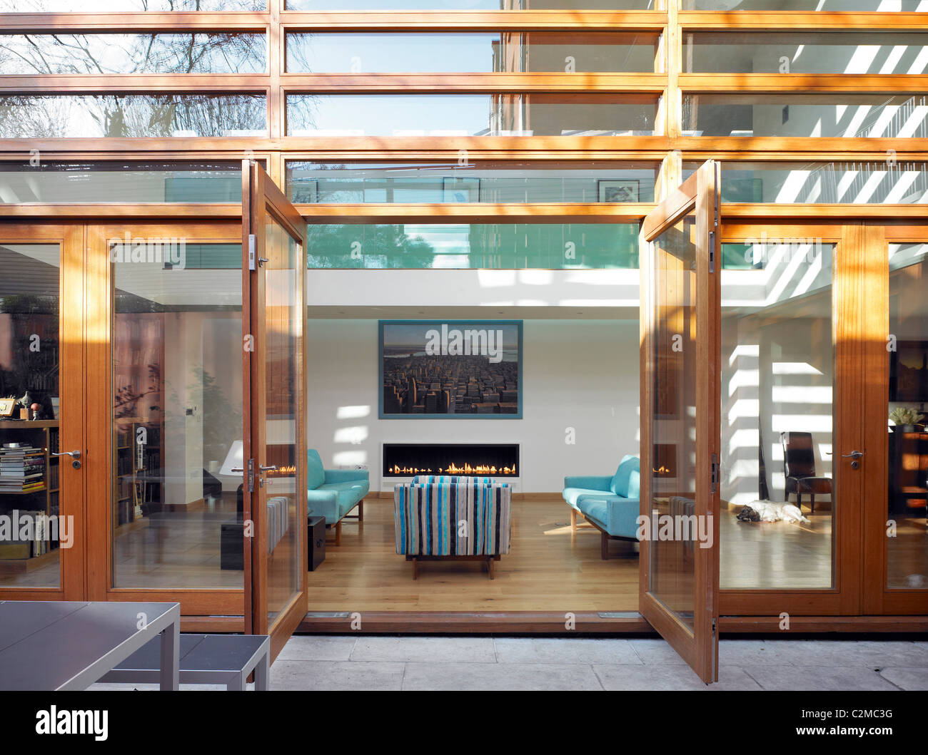 Garden House. Outdoor eating area with wooden patio doors Stock Photo ...