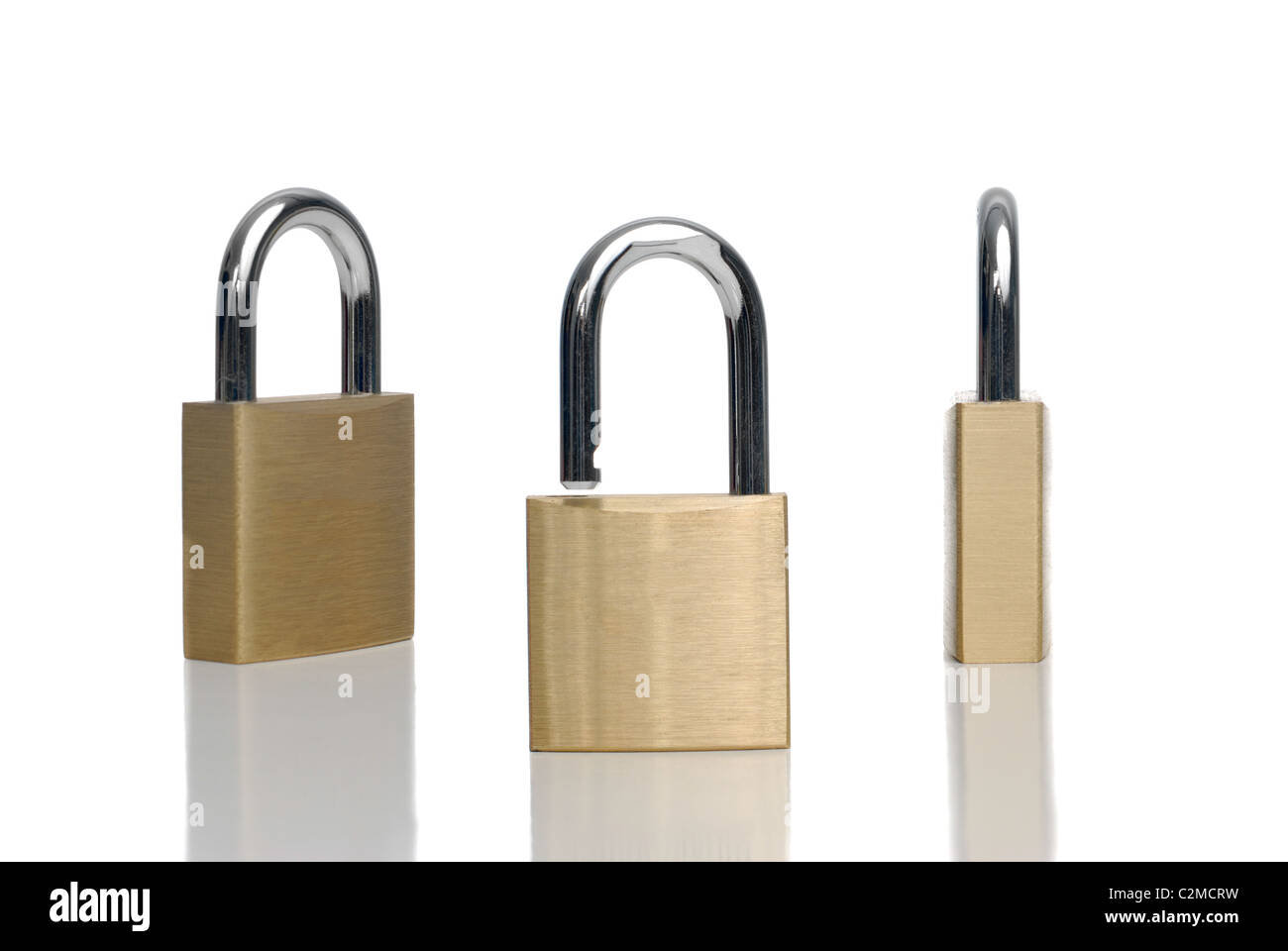 Three security gold locks on white background Stock Photo - Alamy
