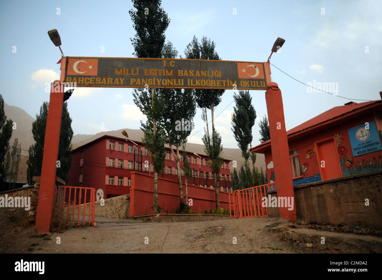 The entrance to a school in the Kurdish village of Bahcesaray, in the ...