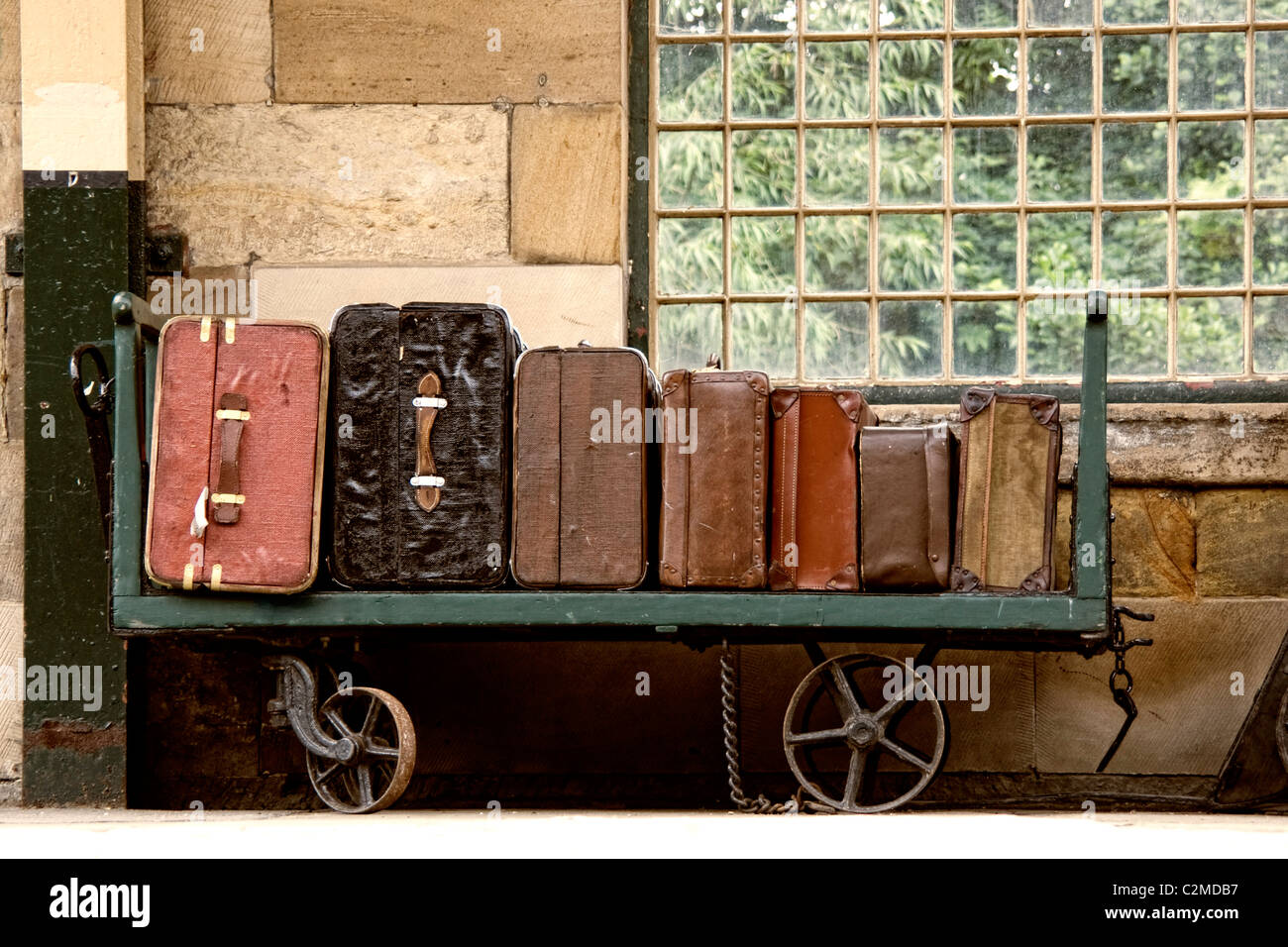 Suitcases On A Luggage Trolley In A Train Station Stock Photo - Alamy