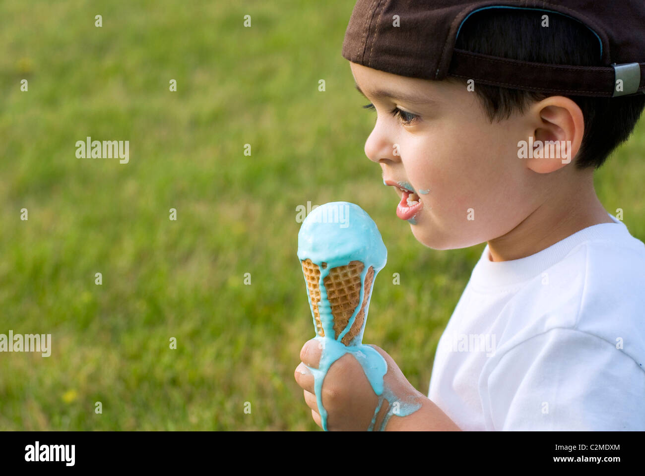 Ice Cream Melting On Boy's Hand Stock Photo - Alamy