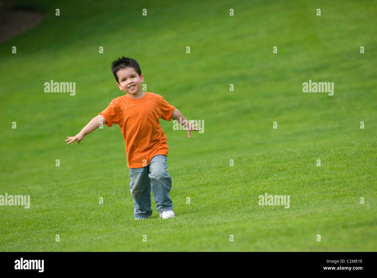 Boy Running Outside Stock Photo - Alamy