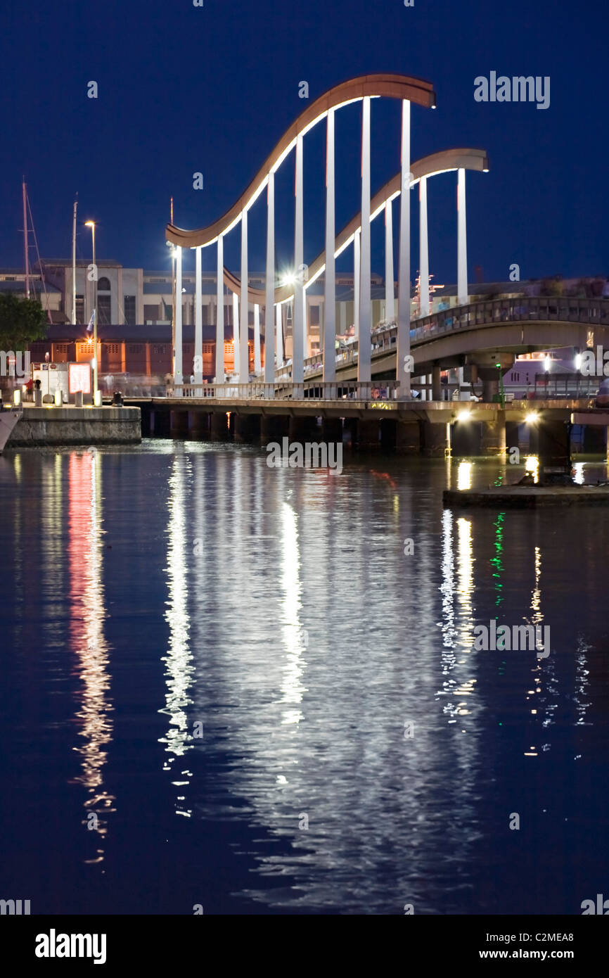 A waterfront view of the Rambla Del Mar bridge and port Barcelona ...