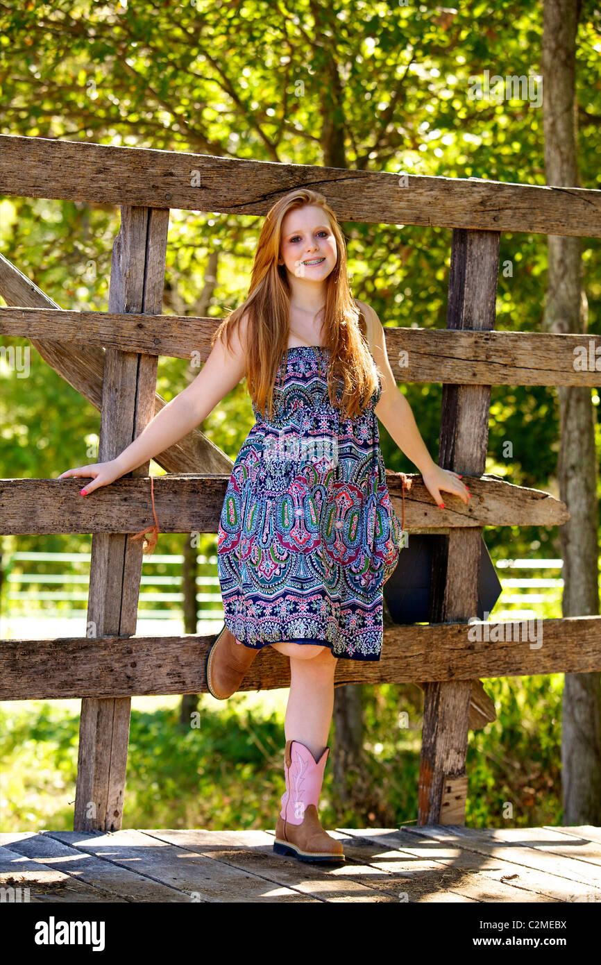 Closeup of a redhead teenage girl on a hay wagon Stock Photo - Alamy