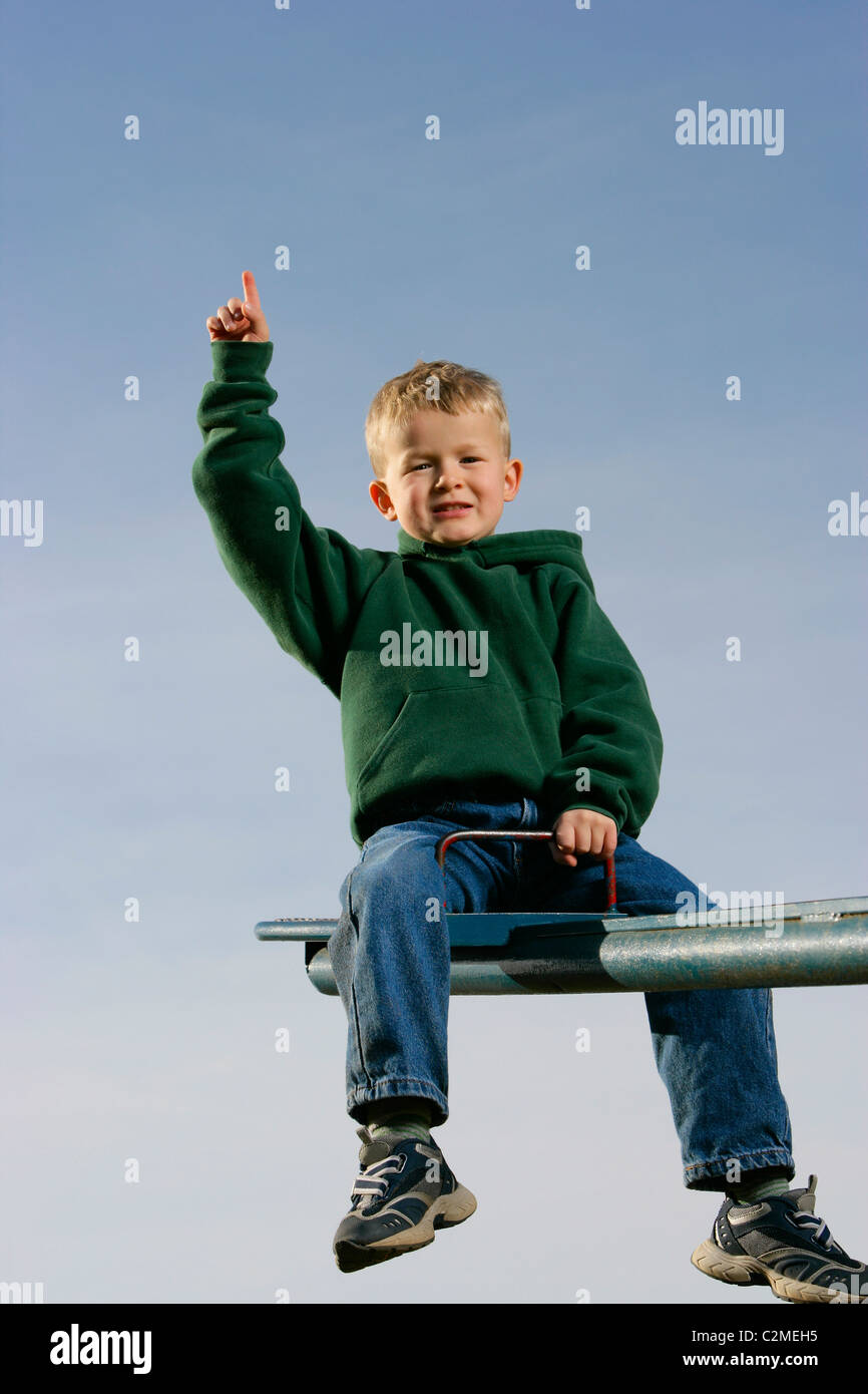 Boy Pointing To The Sky Stock Photo - Alamy