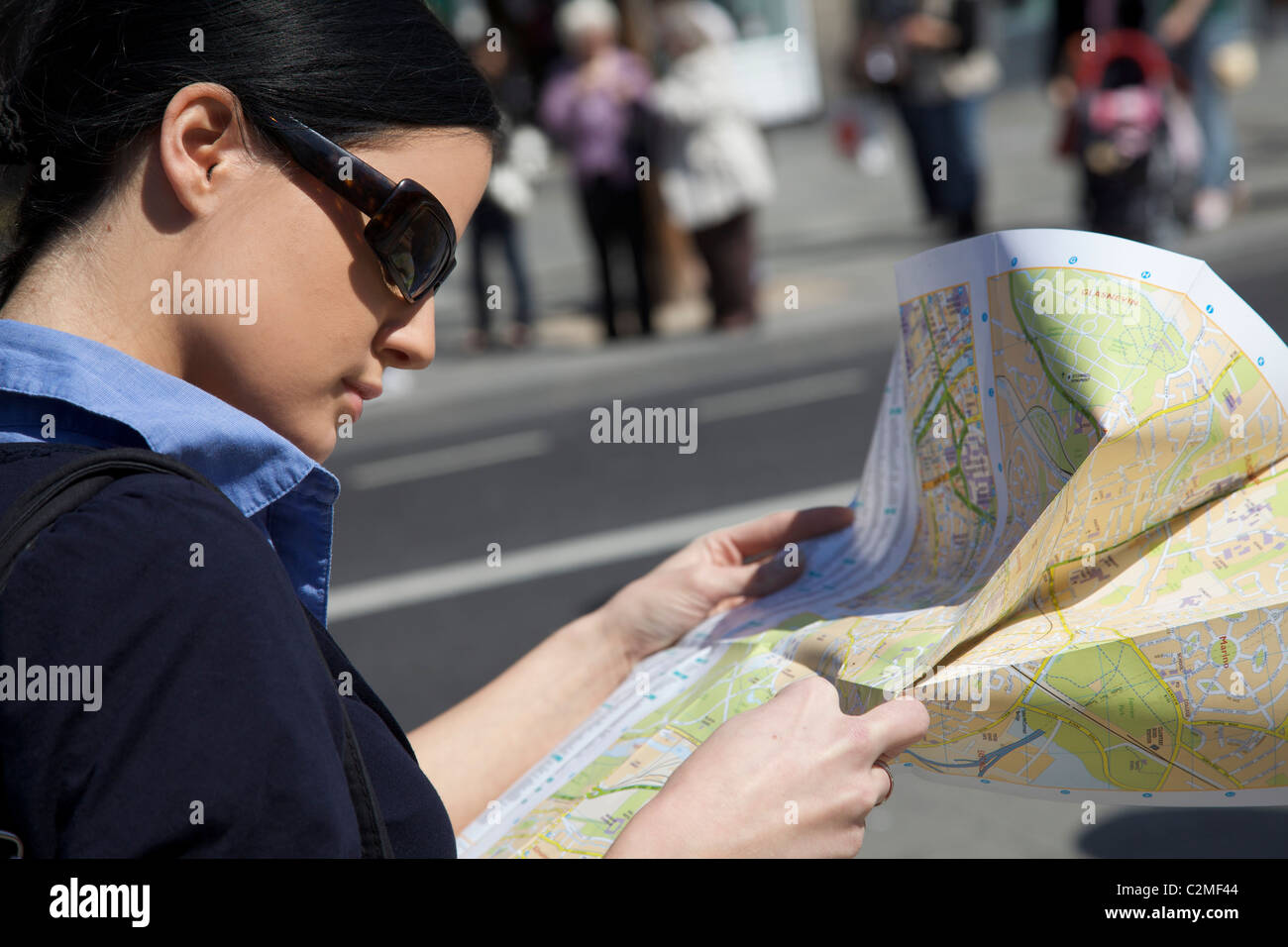 Woman Reading A Map Stock Photo - Alamy