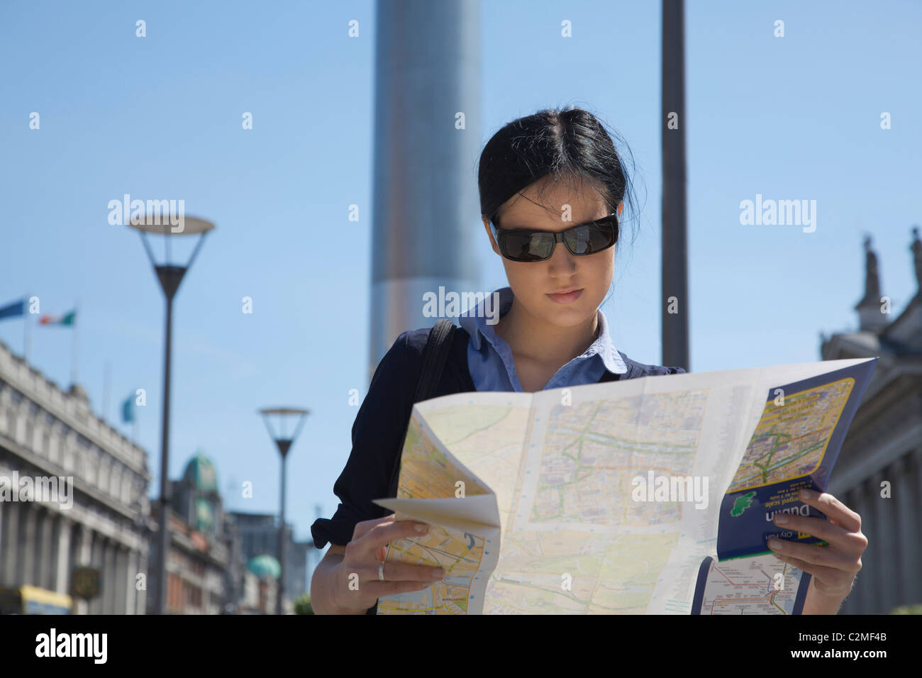 Woman Reading A Map Stock Photo - Alamy