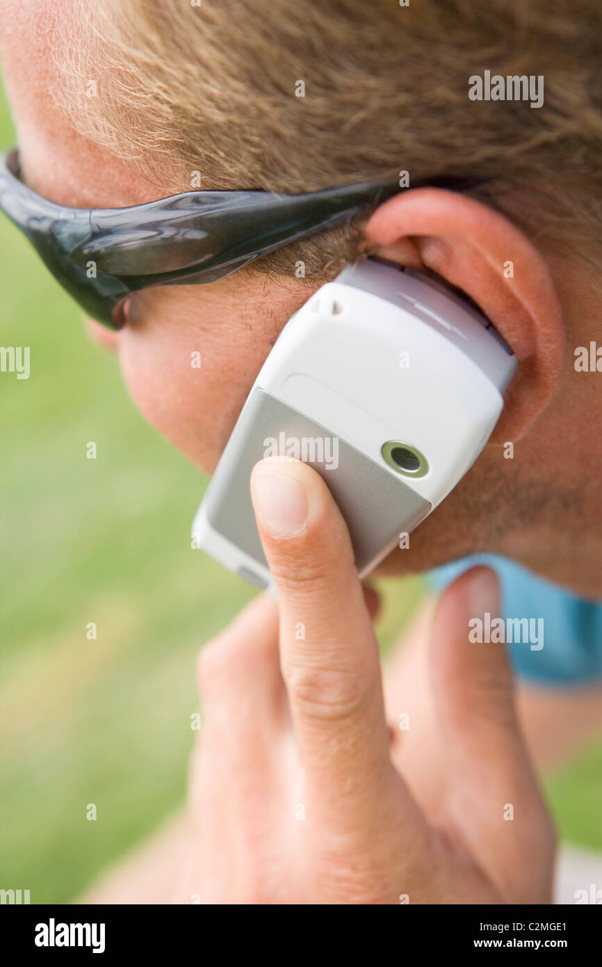 Mobile phone on the ear hi-res stock photography and images - Alamy