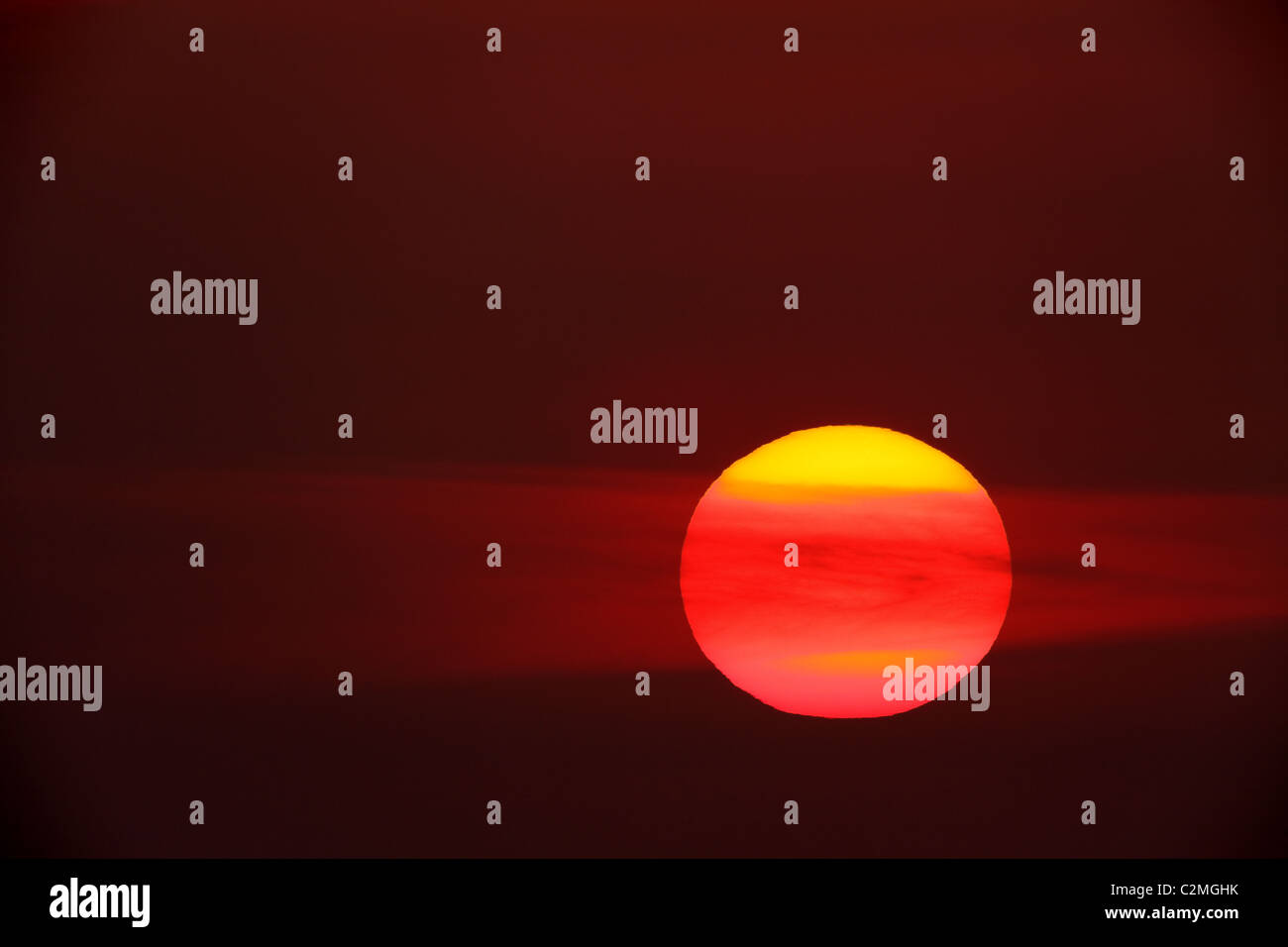 Sunset with a large red sun Stock Photo - Alamy