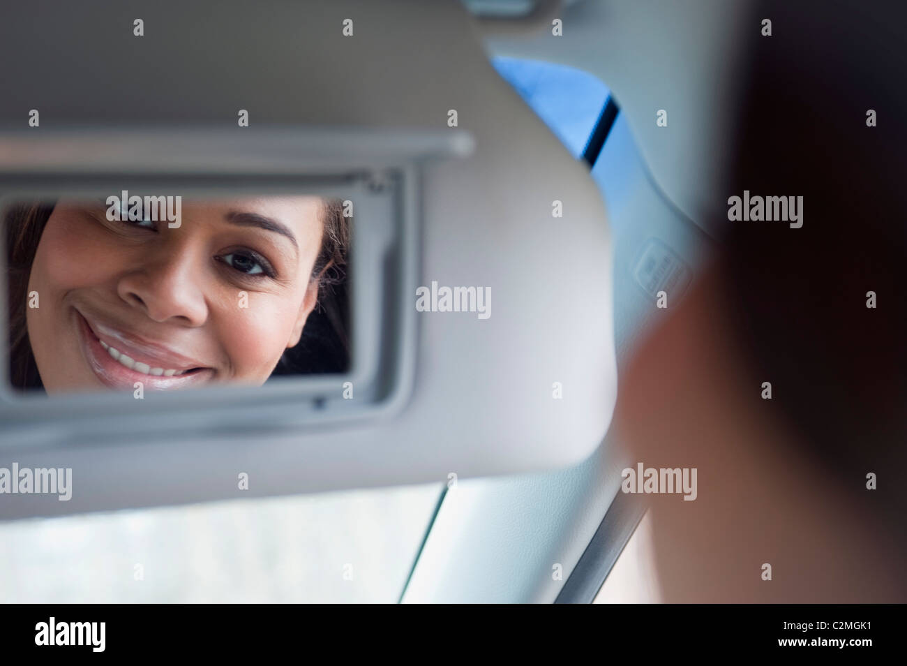 Woman Looking Into A Mirror Stock Photo - Alamy