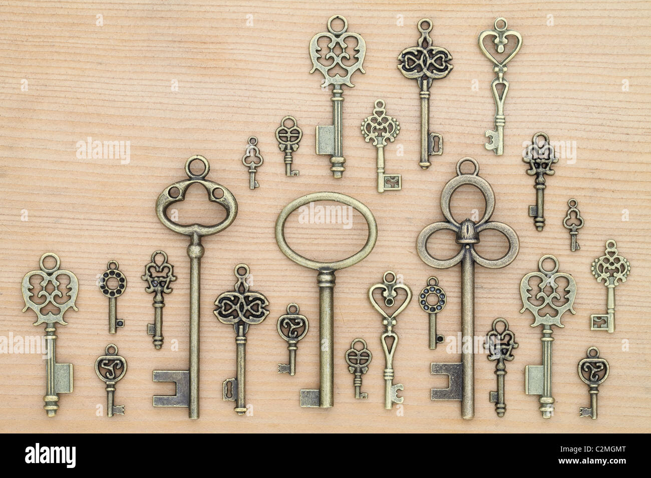 Old keys on wooden table Stock Photo - Alamy