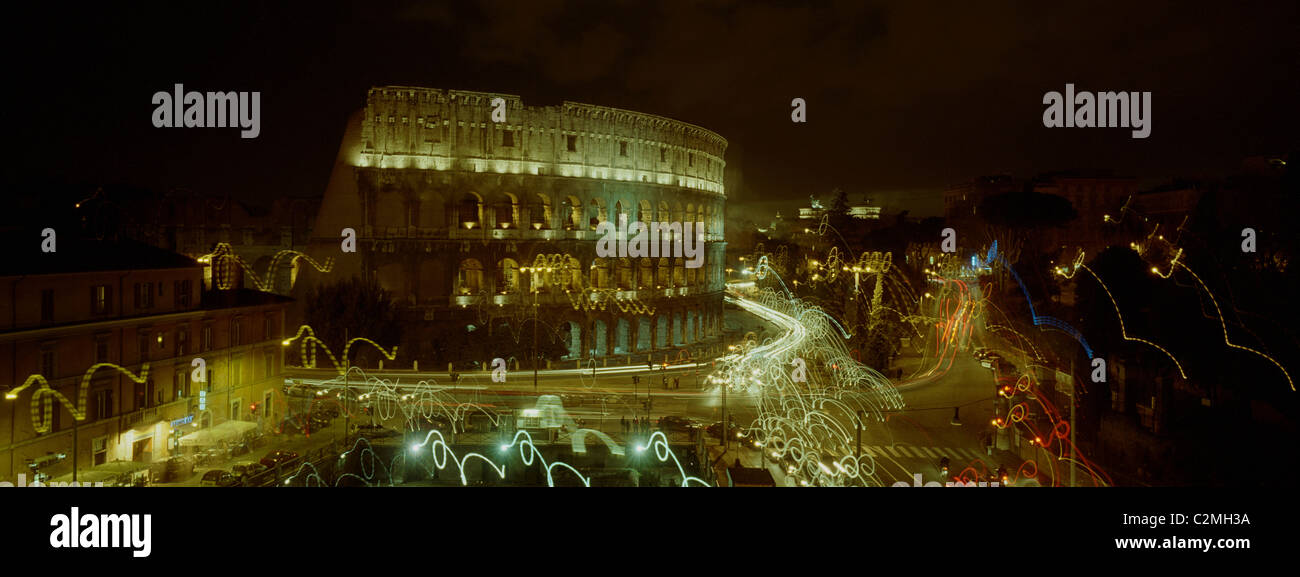 A Panoramic view of Rome at night showing the Coliseum in Rome, Italy ...