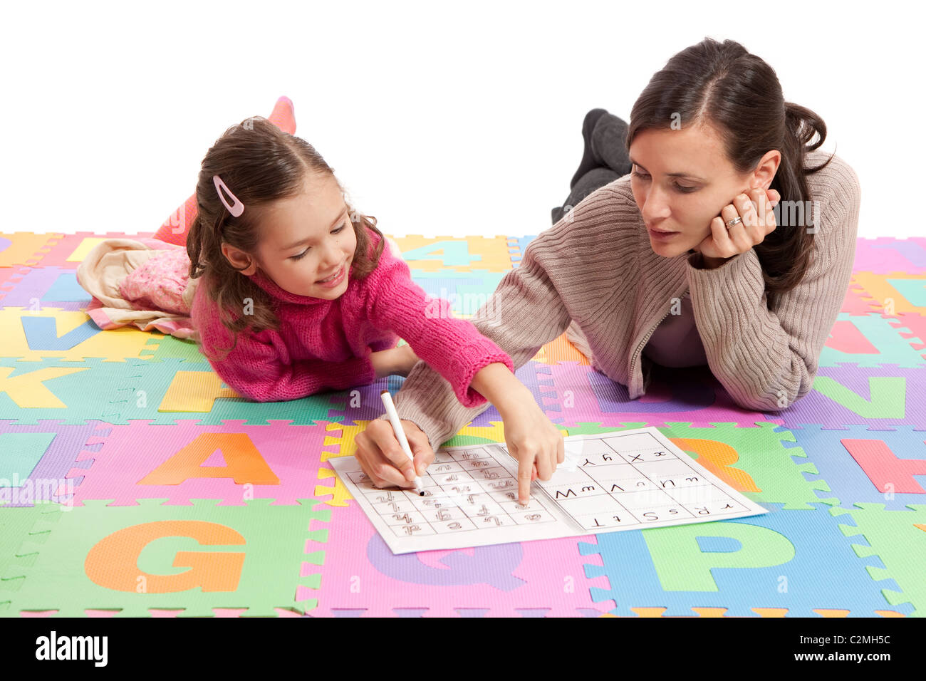 Girl learning handwriting practice from teacher. Isolated on white ...