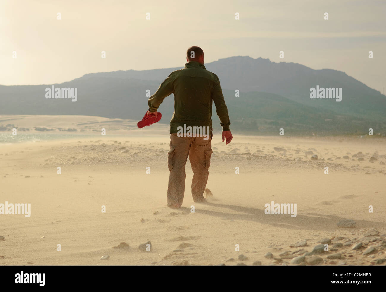 Man Walking On Sand Stock Photo - Alamy