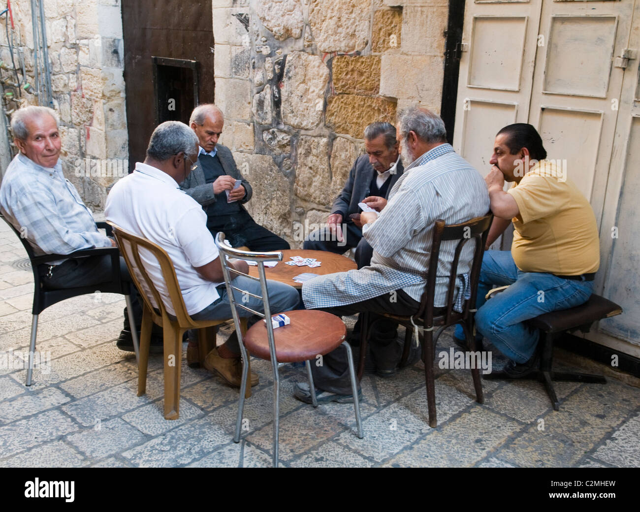 Arab men playing cards in the old city of Jerusalem Stock Photo - Alamy
