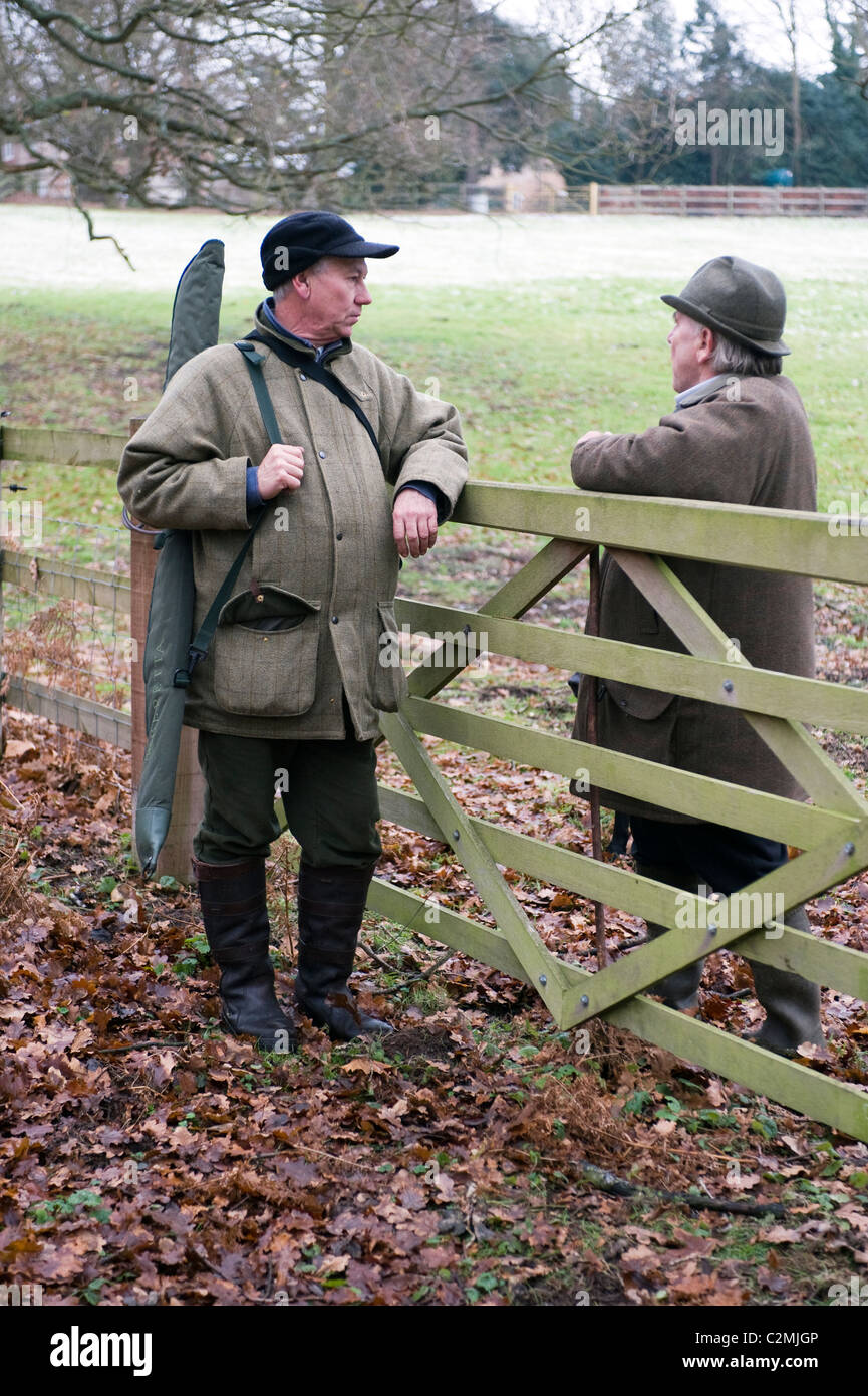 countrymen talking over farm gate Stock Photo - Alamy