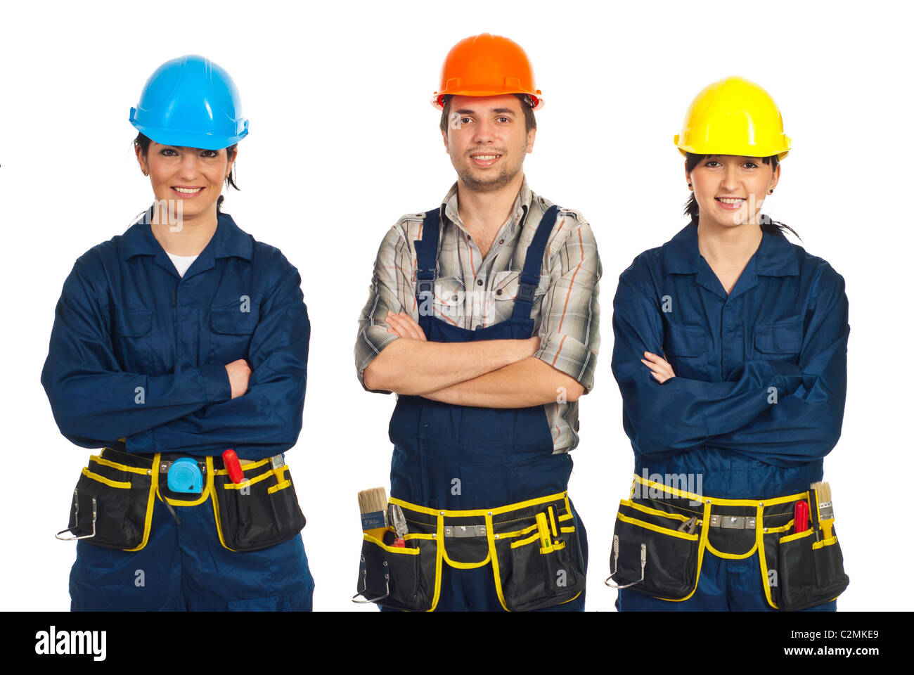 Constructor workers team standing with arms folded in a row and smiling ...