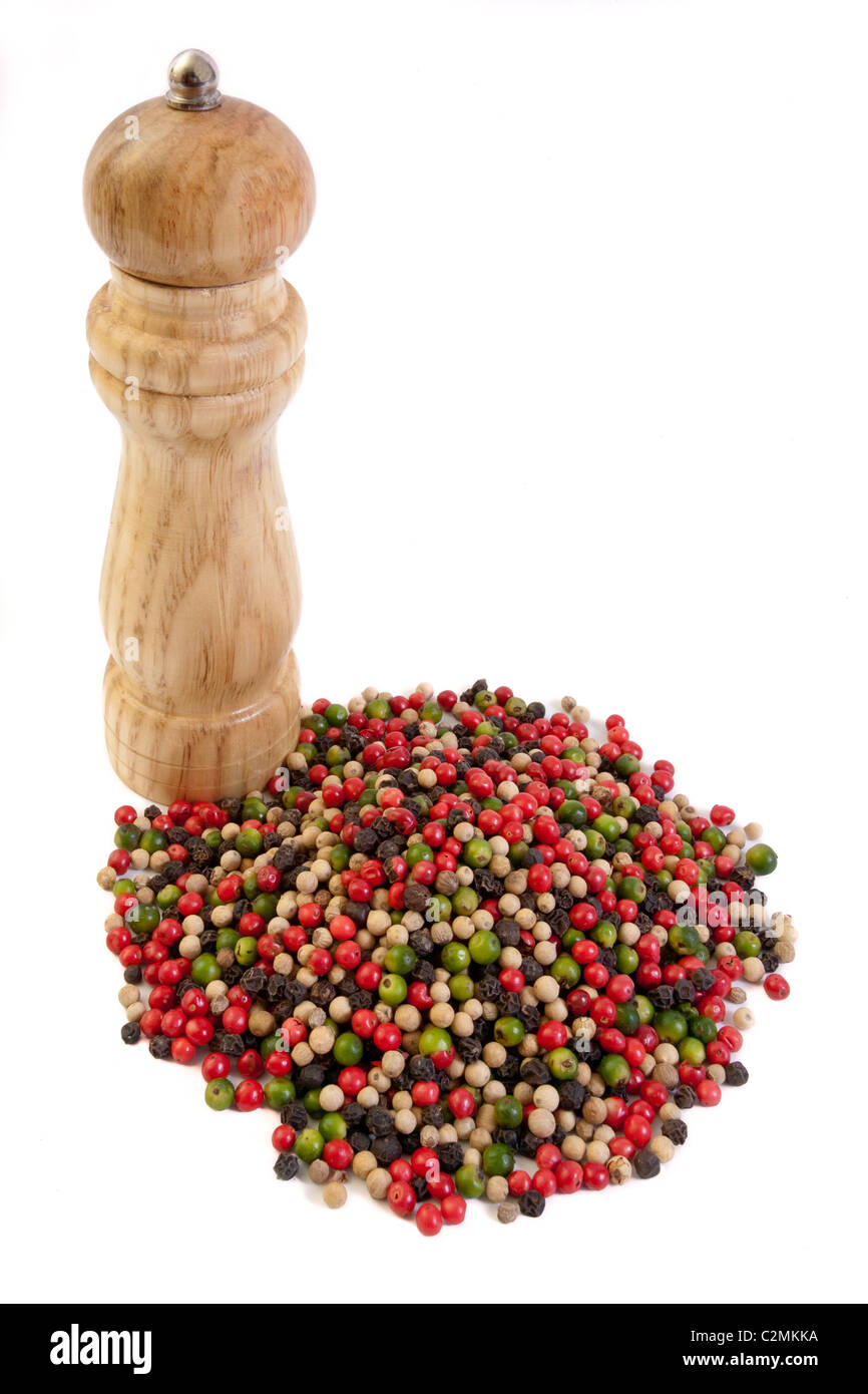 Pepper mill and colorful peppercorns on white background Stock Photo ...