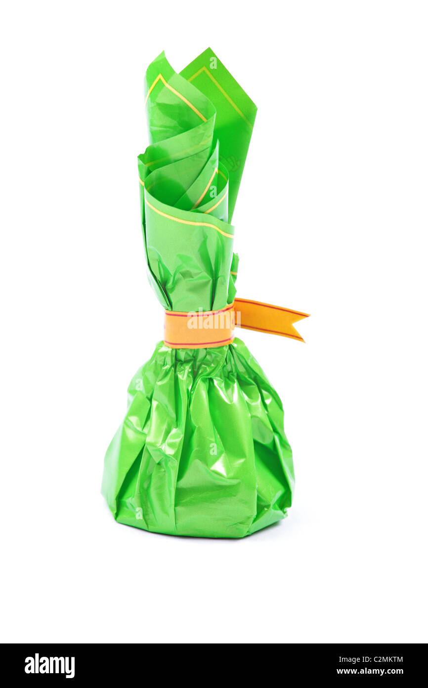 Studio shot of chocolate sweet in green package isolated on white ...