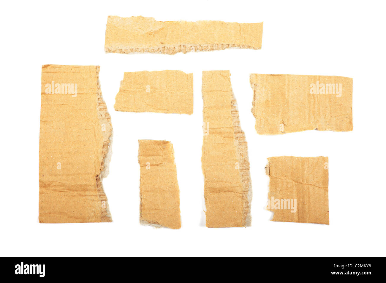 Torn cardboard isolated on white background. As textured background or ...