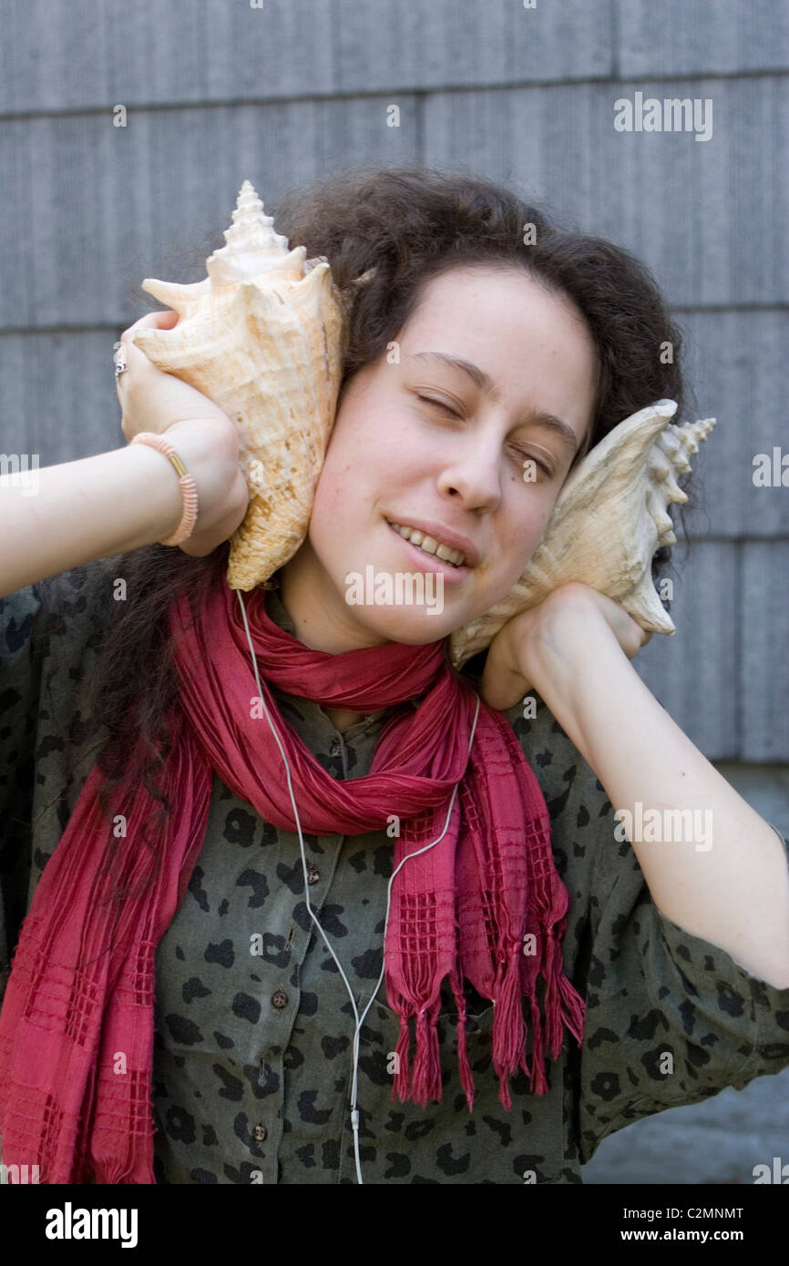 Conch shell listening High Resolution Stock Photography and Images - Alamy