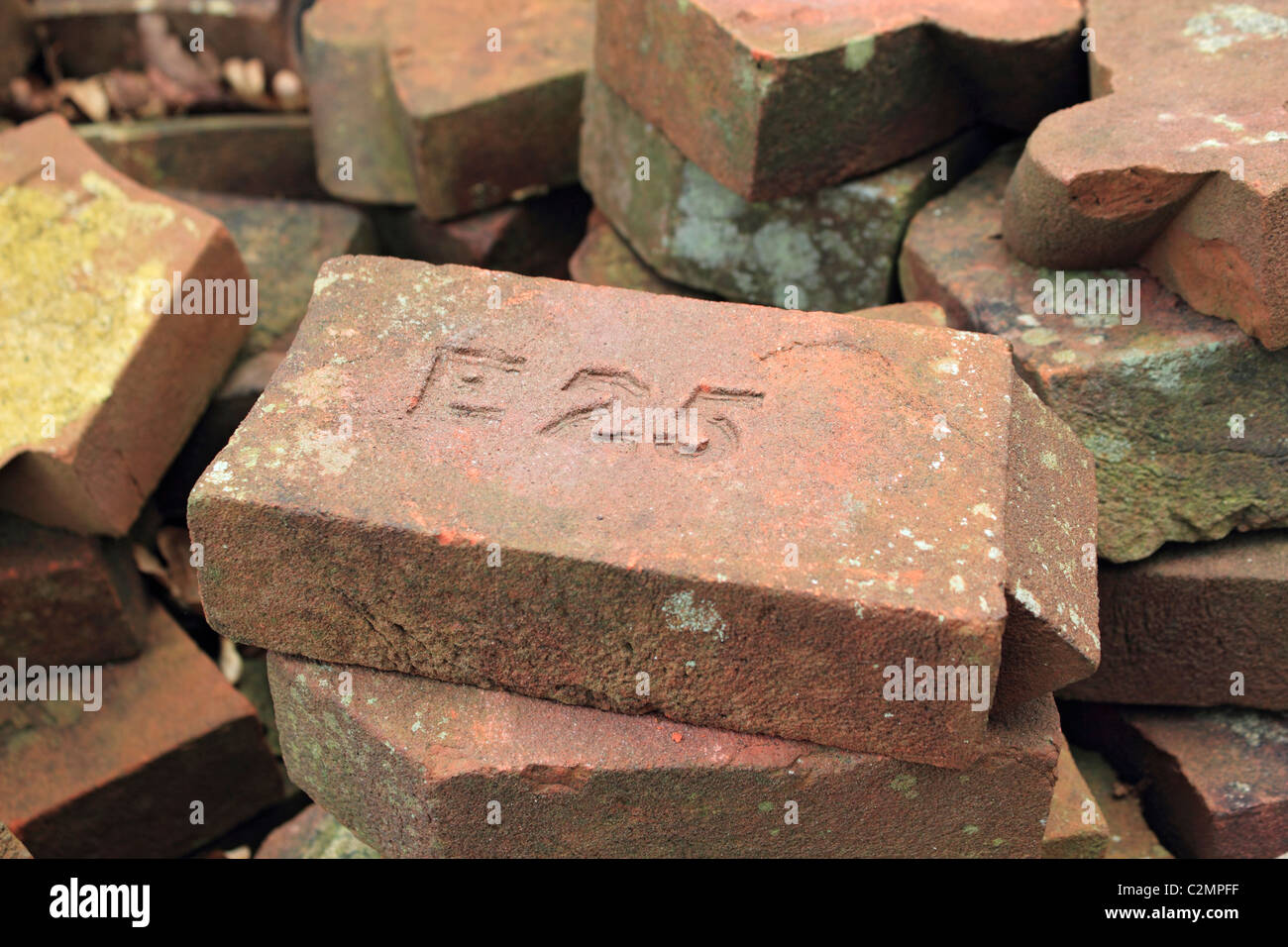 Pile of numbered and shaped bricks stacked in columns England UK Stock ...
