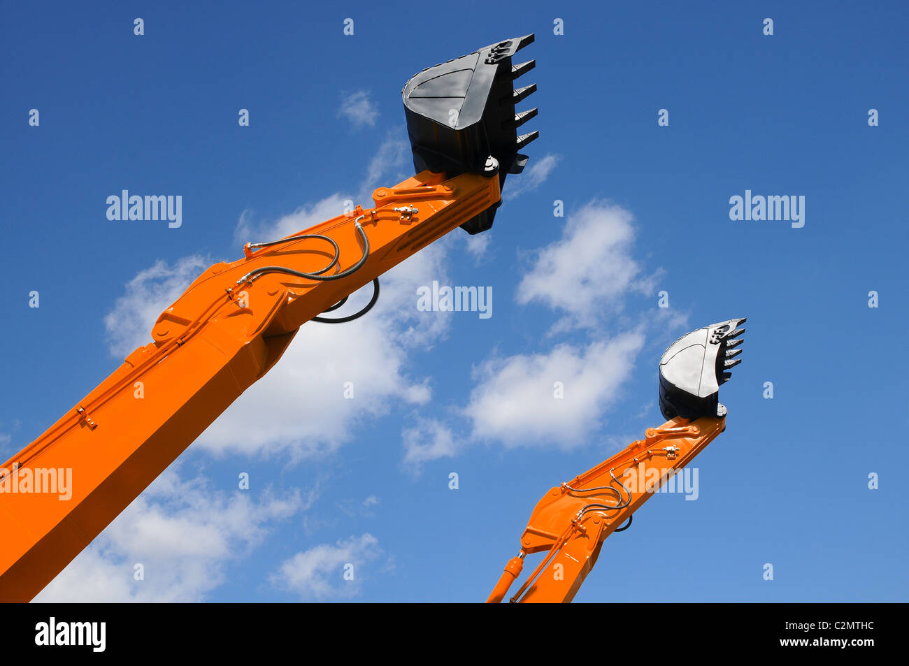 Bulldozer shovel opposite blue sky Stock Photo - Alamy