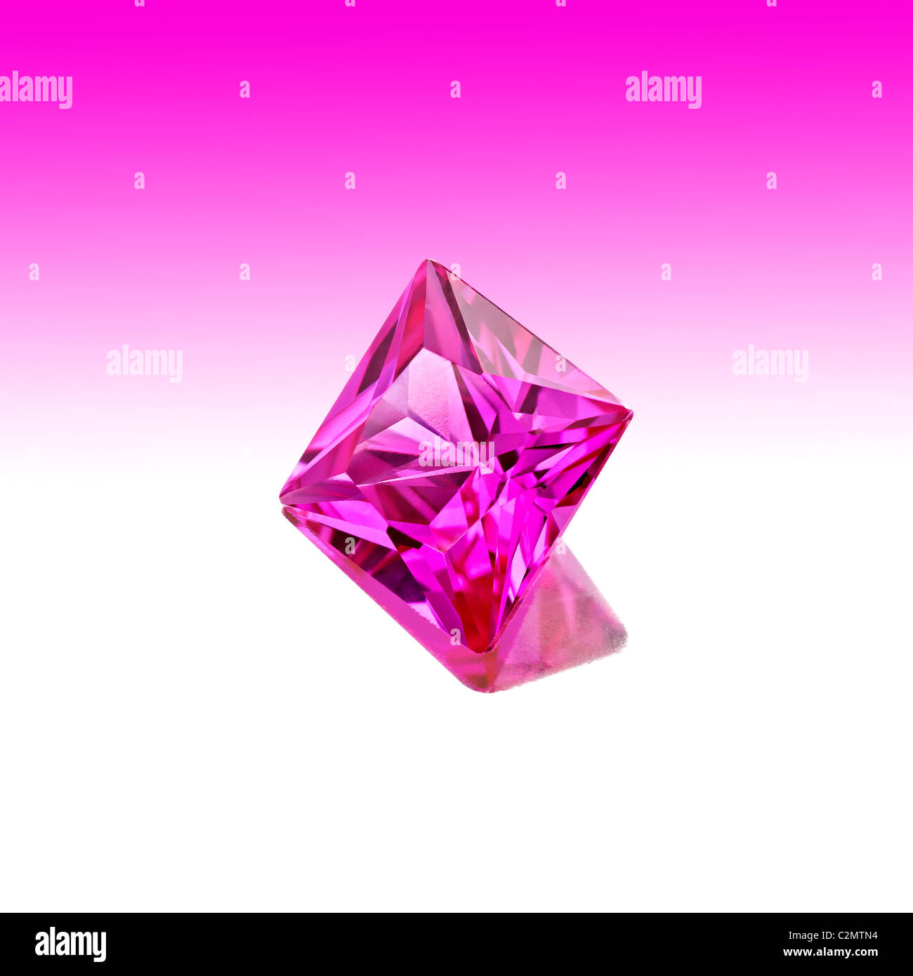 Iso view of pink ruby isolated onpink gradient with drop shadow full ...