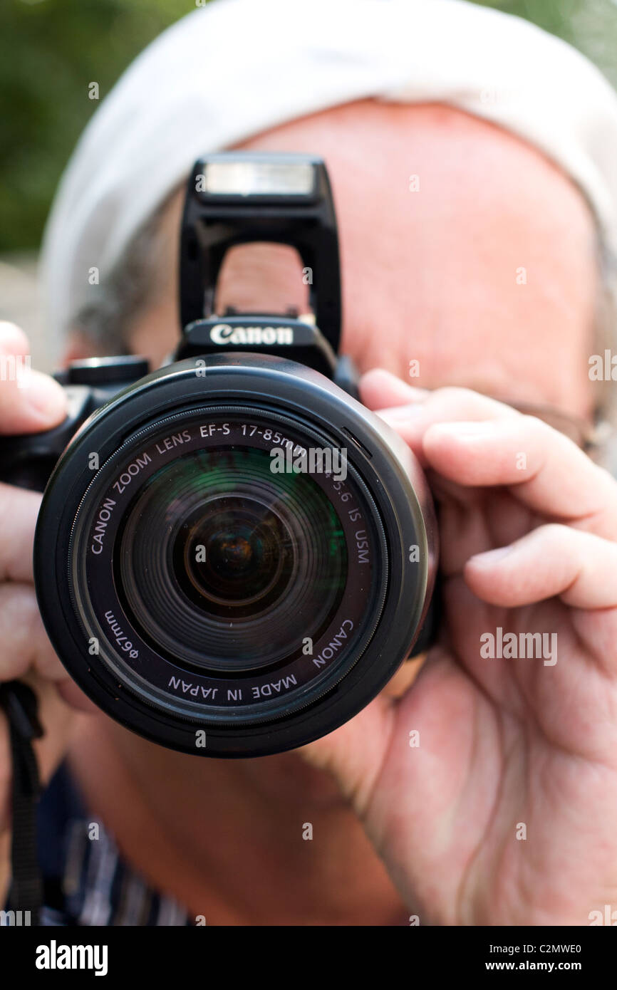 Mature Photographer having fun with his Canon Stock Photo - Alamy