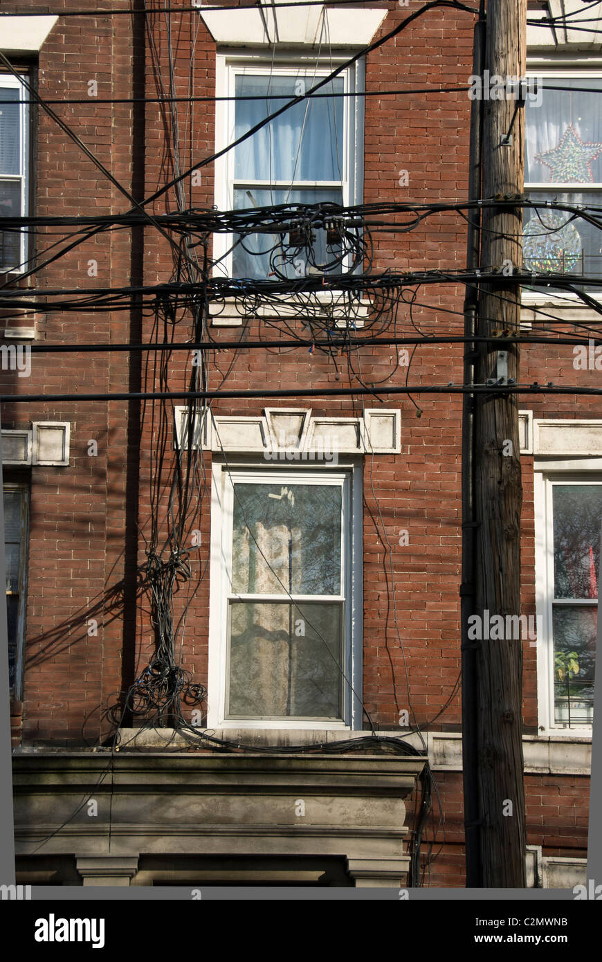 Messy electrical cables on pole hi-res stock photography and images - Alamy