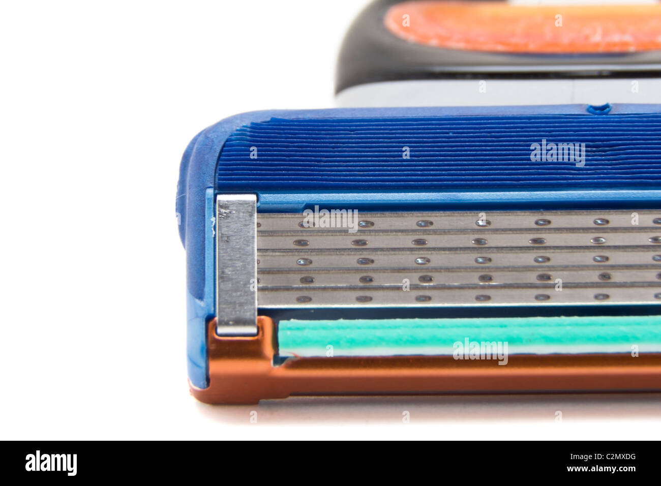 an extreme closeup shot of a razor blade isolated on a white background ...