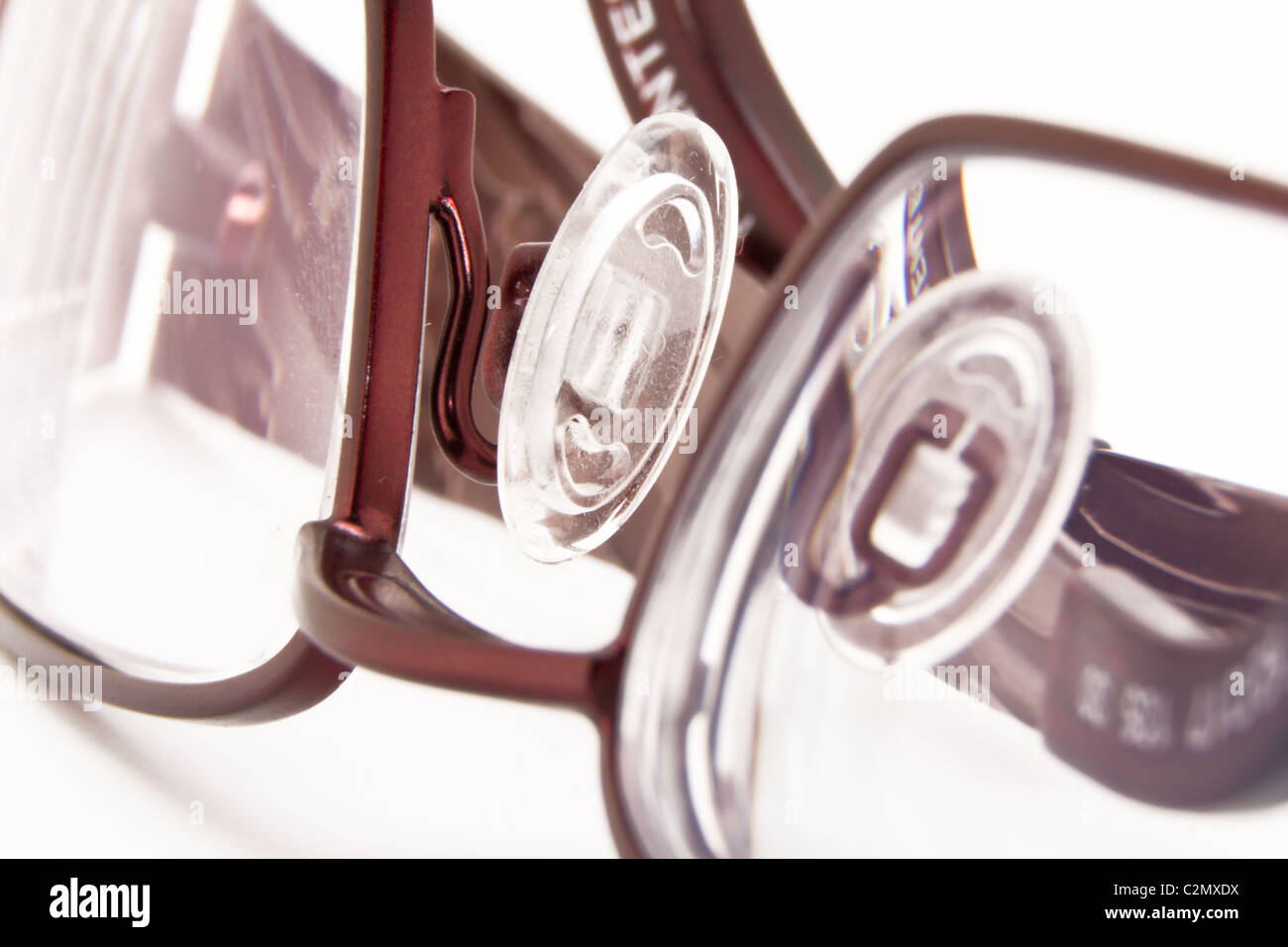 A pair of folded eye glasses on a white background Stock Photo - Alamy