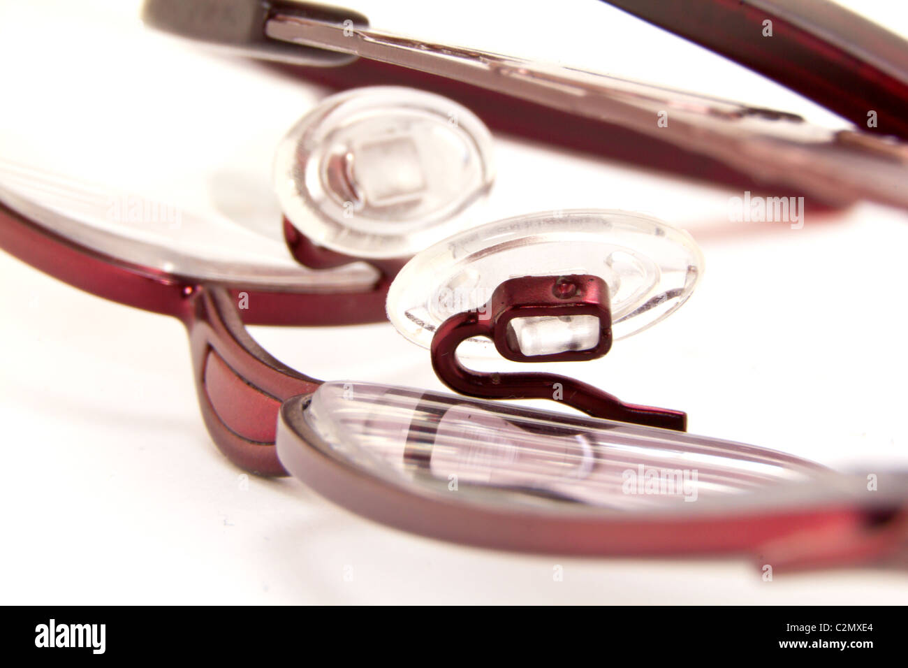 A pair of folded eye glasses on a white background Stock Photo - Alamy